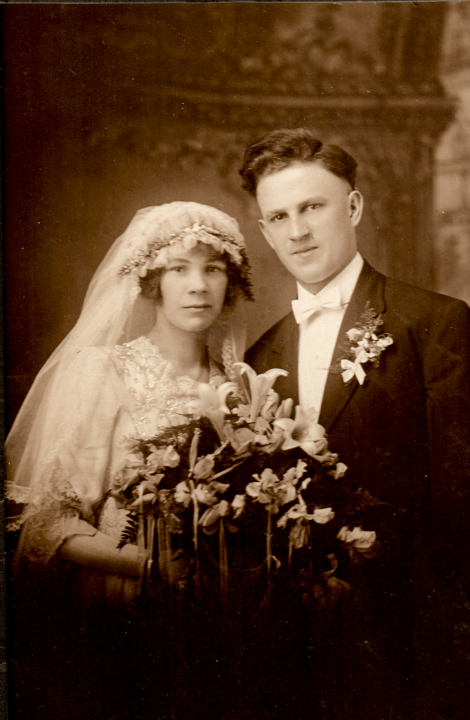 Vintage Wedding Portrait – Bride with Floral Veil and Groom in Tuxedo ...